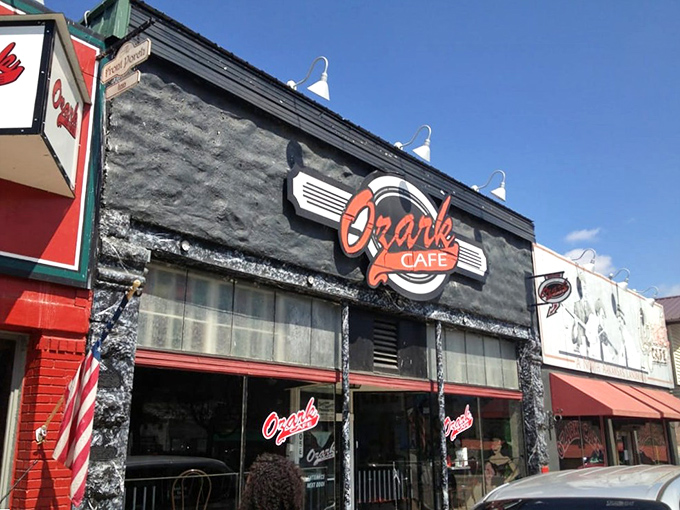 The black facade of Ozark Cafe stands proudly on Jasper's main street, vintage photos and that classic Coca-Cola signage promising authentic Arkansas comfort within.