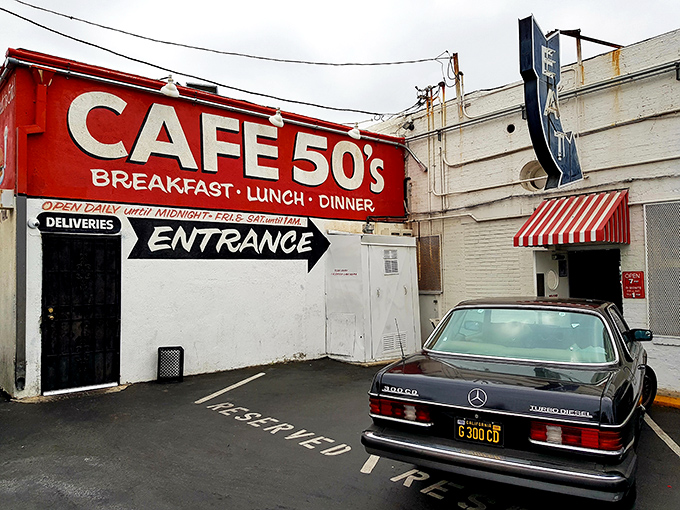 The neon glow of Cafe 50's beckons like a time machine disguised as a diner. Route 66 nostalgia never tasted so good.