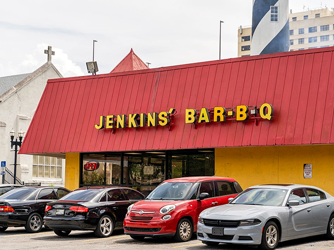 The bright yellow building with its iconic red roof stands like a barbecue beacon in downtown Jacksonville, drawing hungry pilgrims since 1957.