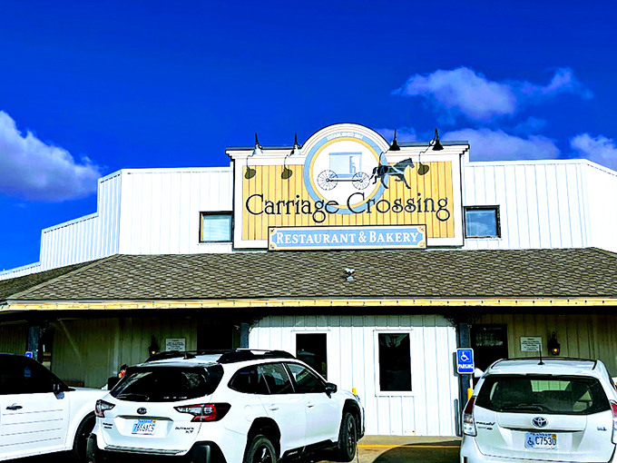 The blue and white exterior of Carriage Crossing stands against a Kansas blue sky like a beacon of comfort food hope in Yoder's Amish country.