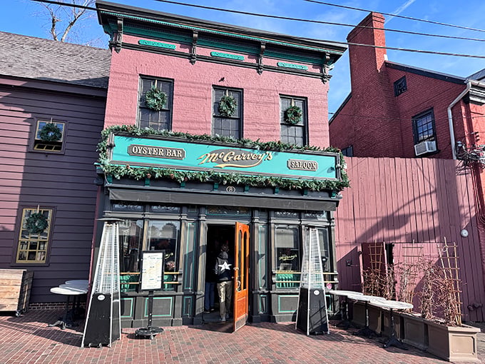 McGarvey's pink brick exterior with its signature green awning stands as a beacon for seafood lovers in historic downtown Annapolis.