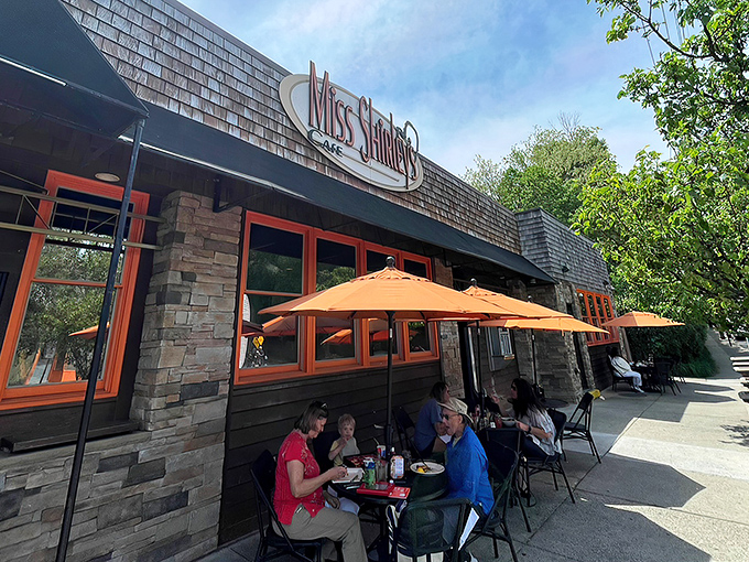 The iconic Miss Shirley's sign welcomes hungry pilgrims to breakfast paradise. Stone and wood exterior with signature orange lettering promises Southern comfort with Maryland flair.