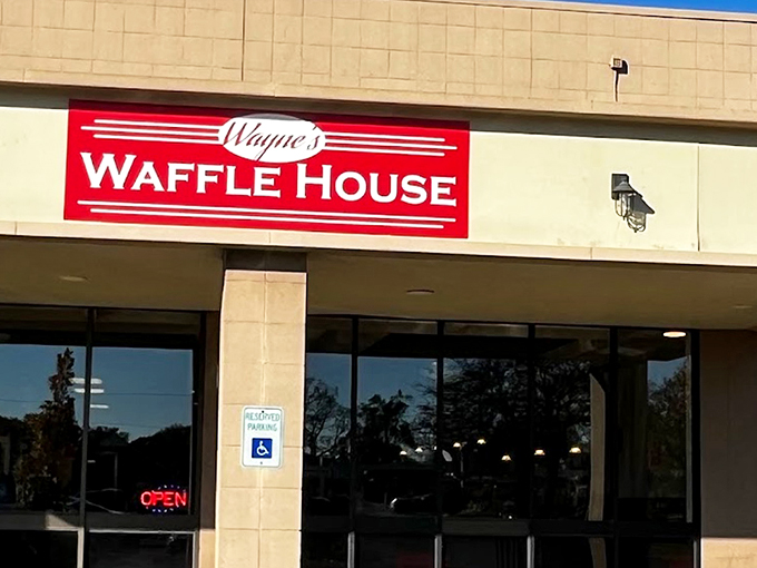 The bright red sign beckons like a lighthouse for the breakfast-starved. Wayne's Waffle House stands ready to fulfill your deepest carb fantasies. 