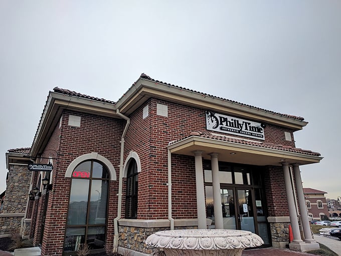The stately brick exterior of Philly Time stands like a temple to sandwich perfection, complete with columns that say "We take our cheesesteaks seriously."