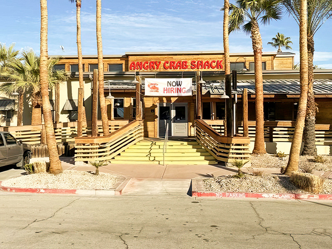 Palm trees and wooden ramps welcome you to seafood paradise&mdash;where the desert meets the ocean at Angry Crab Shack's inviting Henderson location.