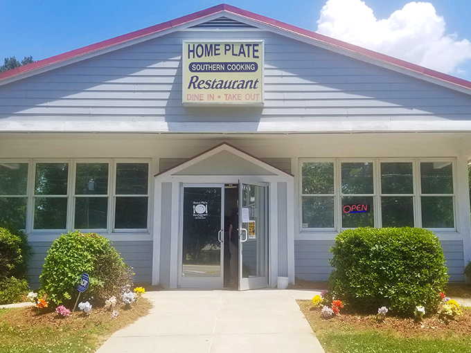 The modest white exterior with its simple sign says everything you need to know: no gimmicks, just honest Southern cooking that keeps locals coming back.