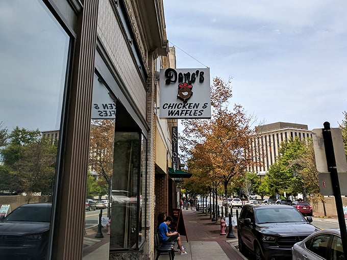 The brick exterior of Dame's Chicken & Waffles stands like a beacon of comfort food in downtown Durham, promising culinary adventures worth every calorie.