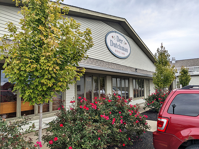 Der Dutchman's welcoming facade stands like a beacon of buttery hope along US-42, where both sedans and horse-drawn buggies find common parking ground.