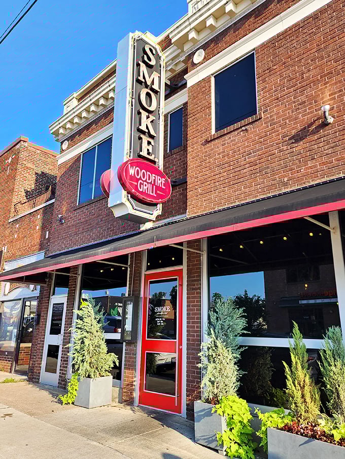 The iconic blue "SMOKE" sign stands sentinel on Cherry Street, a beacon for hungry Tulsans seeking wood-fired salvation in brick-and-mortar form.