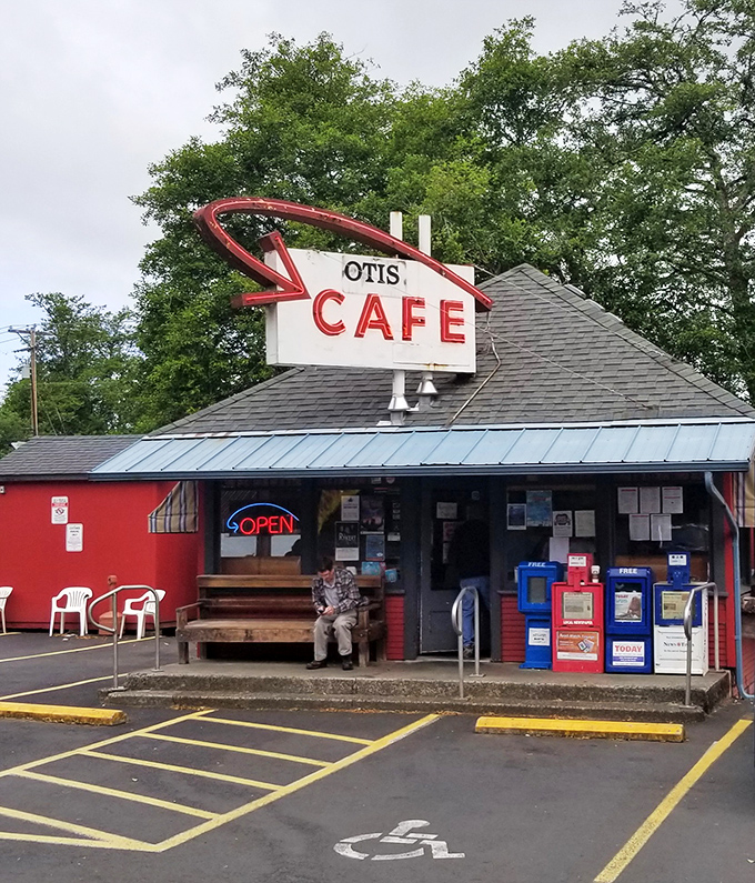 The iconic red exterior of Otis Caf&eacute; stands like a beacon for hungry travelers on Highway 18, promising comfort food salvation just minutes from the Oregon coast. 