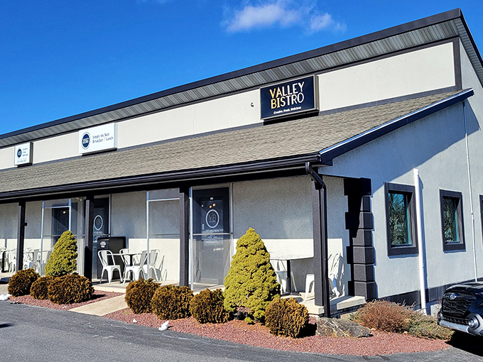 Valley Bistro's unassuming exterior hides culinary treasures within, like finding a Michelin-worthy meal in your neighbor's garage. Those manicured shrubs are just the appetizer.