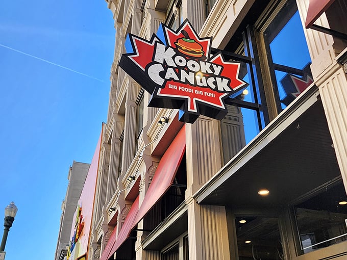 The iconic maple leaf sign beckons hungry adventurers to Kooky Canuck, where Canadian charm meets Memphis hospitality on downtown's bustling streets.