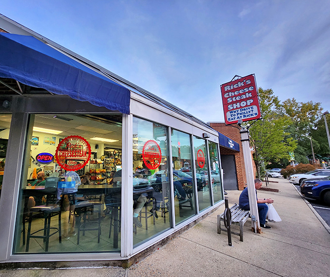 The blue awning and iconic sign beckon like an old friend. "Why drive to Philly?" Indeed, why would you when this cheesesteak paradise awaits? 