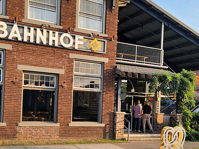Bahnhof's brick exterior beckons like a portal to Bavaria, complete with that unmistakable pretzel sculpture that says, "Yes, carb-lovers, this is your happy place."