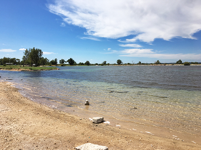 Crystal clear waters stretch to the horizon, proving that sometimes the best beaches aren't anywhere near an ocean. Oklahoma's liquid surprise.