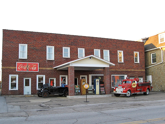 The brick facade of "The Building" with its vintage gas pumps standing guard feels like a time portal to America's automotive golden age.