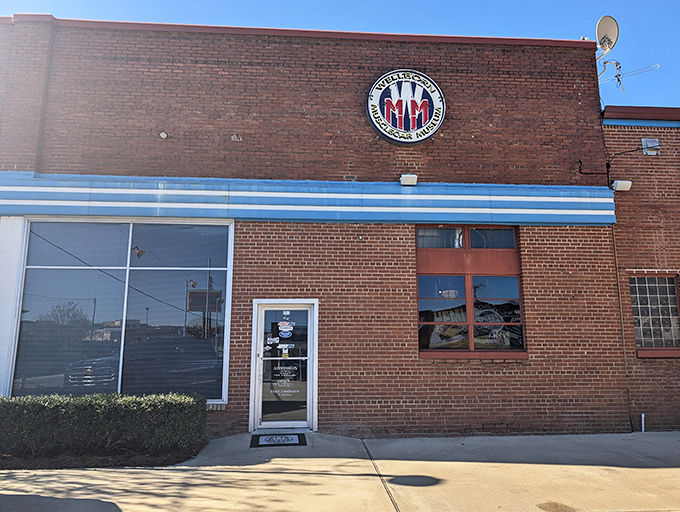 That vintage neon sign beckoning from the street promises automotive adventures that'll make your heart race faster than a Hemi.