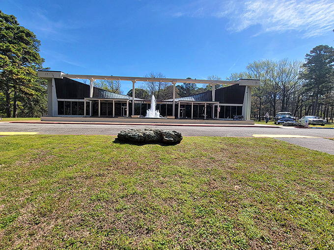 The Museum of Automobiles stands like a mid-century modern temple to transportation, its distinctive butterfly roof and dancing fountains welcoming visitors to automotive paradise.