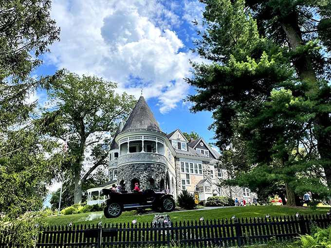 The Marshall mansion stands like a Victorian dream, its turrets and wraparound porch inviting you to step back into a more elegant era.
