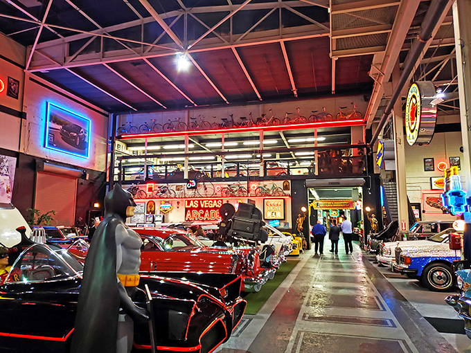 Ferrari meets vintage elegance in this automotive paradise. The checkerboard floor adds a touch of racing nostalgia to this incredible collection.