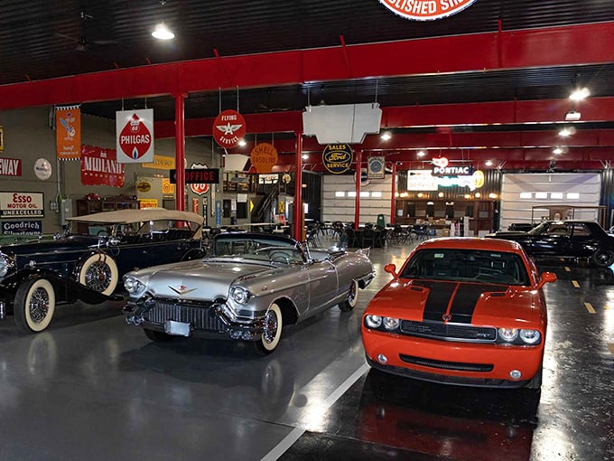 Step into automotive heaven where vintage storefronts and gleaming classics create a time-traveling wonderland. That blue convertible looks ready for a sunset cruise down memory lane.