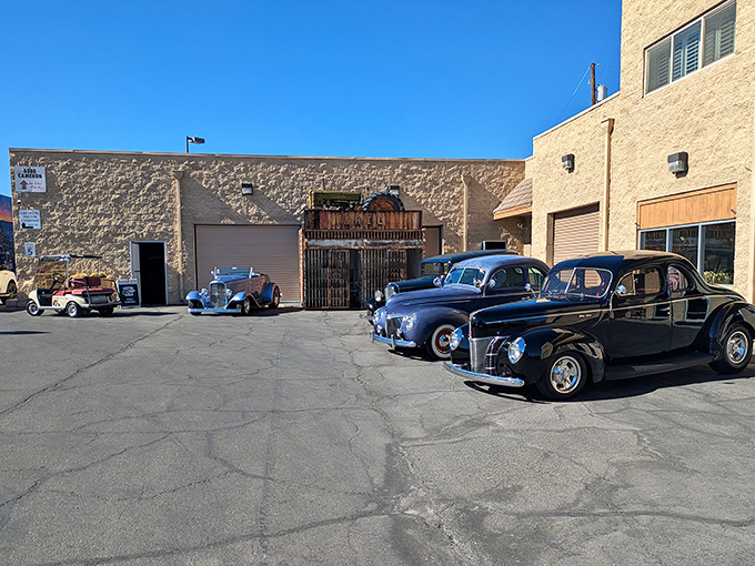 Modern muscle meets classic charm outside Nostalgia Street Rods. These gleaming Corvettes are just appetizers for the automotive feast waiting inside.