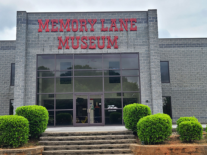 The unassuming exterior of Memory Lane Museum stands like a vault of automotive history, promising treasures that would make any car enthusiast's heart race faster than a NASCAR qualifier.