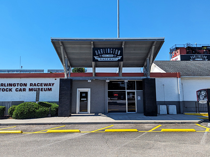 The unassuming white brick facade belies the treasures within, like finding a five-star restaurant in a gas station. Racing history awaits!