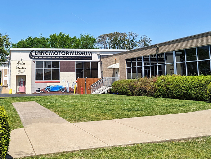 The unassuming exterior of Lane Motor Museum, where automotive dreams hide behind a vintage bakery facade. Who knew bread and bizarre vehicles had so much in common?