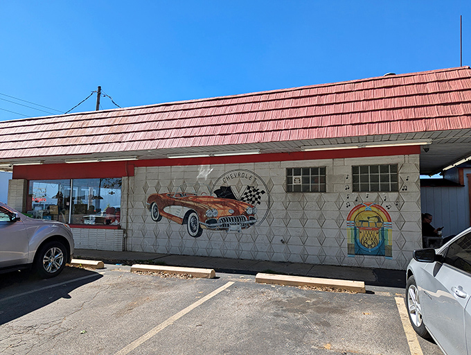 The unassuming entrance to Rock-Cola 50's Cafe might not scream "culinary destination," but that neon OPEN sign is your portal to breakfast nirvana.