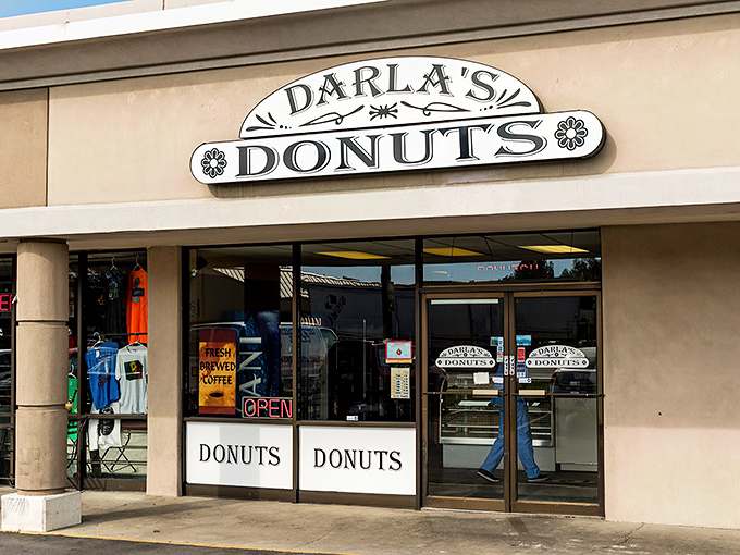 The unassuming storefront of Darla's Donuts stands like a beacon of hope for the sugar-deprived. No fancy frills, just the promise of donut perfection within.