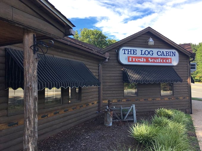 The rustic exterior of The Log Cabin isn't just charming&mdash;it's a promise that what awaits inside is authentic, unpretentious, and deliciously memorable.