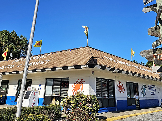 Yellow flags flutter like culinary beacons above this unassuming roadside treasure. The gravel parking lot filled with pickup trucks tells you everything you need to know.