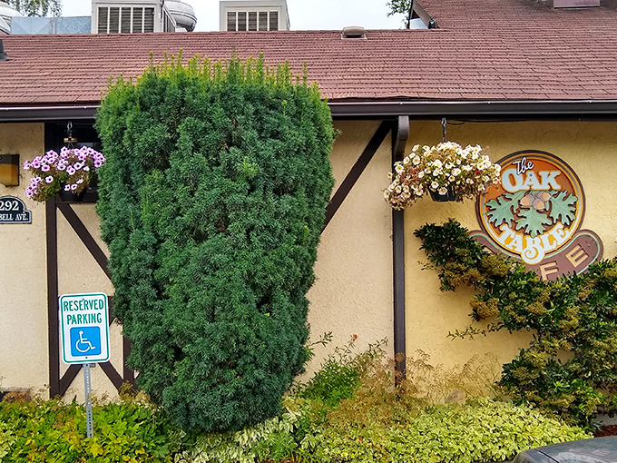 The entrance to breakfast paradise! Wooden bears stand guard at The Oak Table Cafe's doorway, promising a Pacific Northwest dining experience worth waking up for.