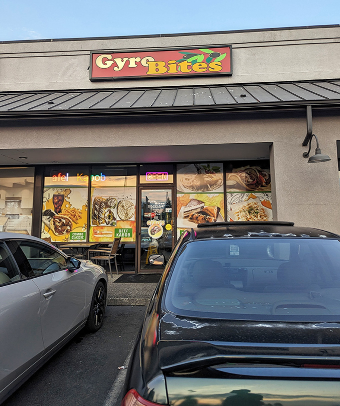 The colorful Gyro Bites sign beckons like a Mediterranean lighthouse in a sea of strip mall sameness. No pretension, just promise.