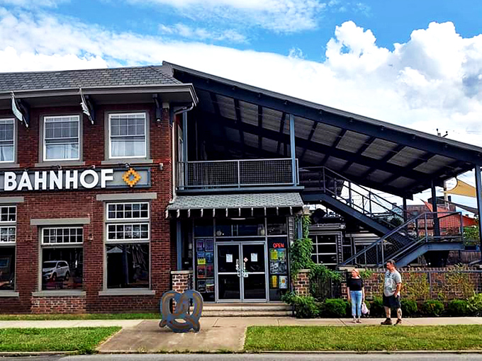 Bahnhof's brick exterior beckons like a portal to Bavaria, complete with that unmistakable pretzel sculpture that says, "Yes, carb-lovers, this is your happy place."