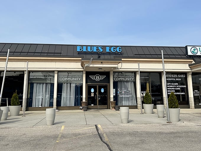 The blue awning beckons like a breakfast lighthouse, guiding hungry souls to this Milwaukee morning haven where French toast dreams come true.