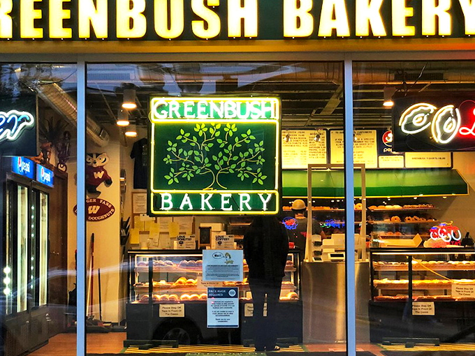 The iconic green and yellow storefront of Greenbush Bakery stands as a beacon of hope for donut lovers across Madison. That neon "Kosher" sign promises authentic goodness inside. 