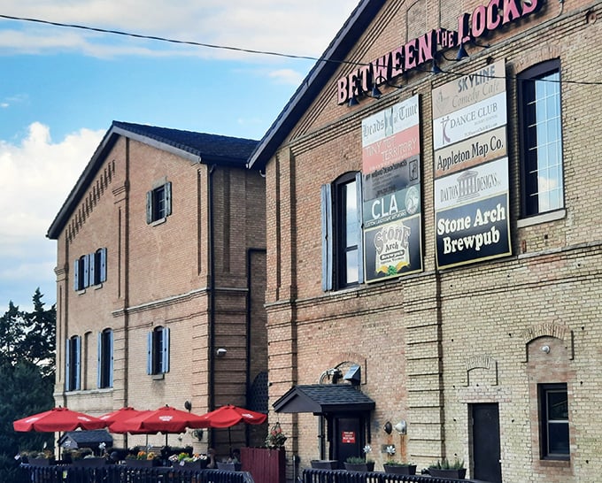 Stone Arch Brewpub's historic brick exterior with blue shutters stands as Appleton's answer to "where should we eat tonight?" Timeless charm meets modern craft brewing.