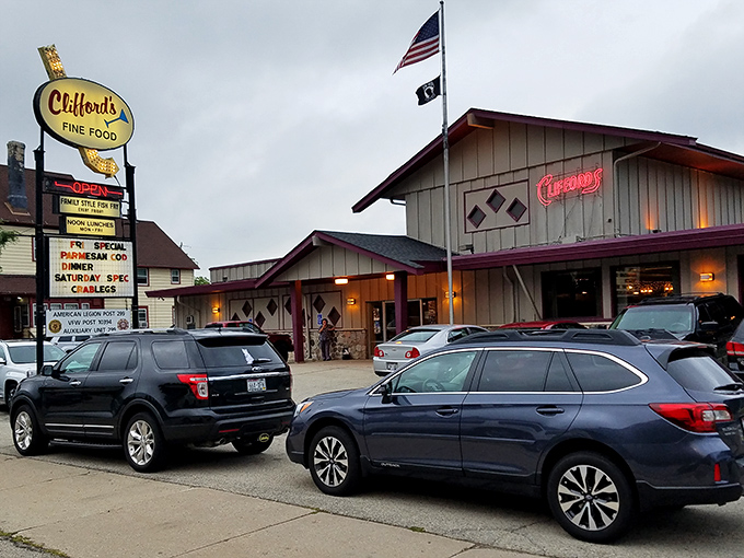 Clifford's vintage sign glows like a beacon for hungry travelers. This unassuming exterior hides Wisconsin's fish fry paradise within.