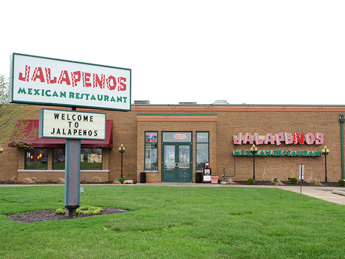 The red sign beckons like a culinary lighthouse on the Illinois prairie—Jalapenos stands ready to rescue you from mundane meals with its brick-and-mortar promise of Mexican delights.