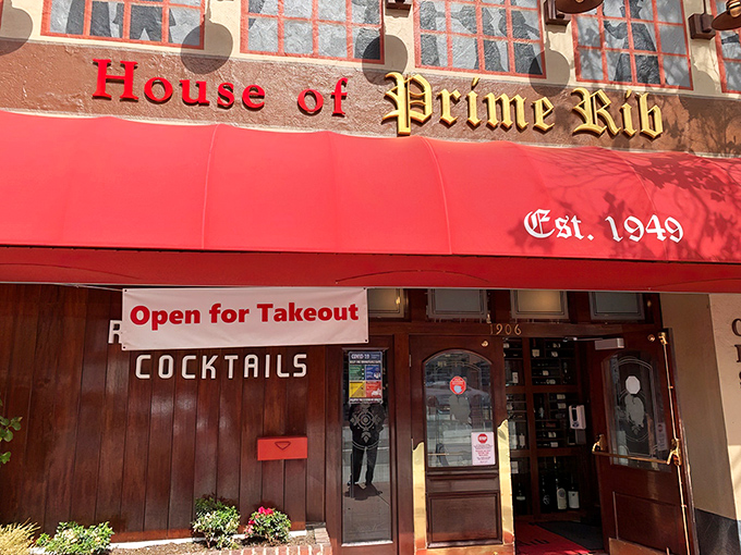 The iconic red awning of House of Prime Rib beckons like a meaty lighthouse on Van Ness Avenue, promising carnivorous delights within.