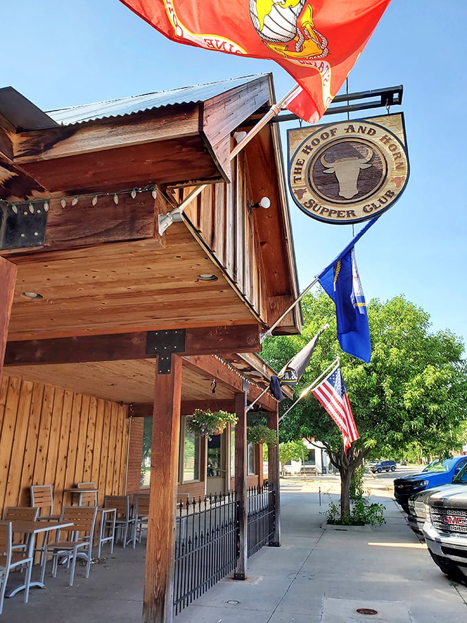 The rustic wooden exterior of The Hoof & Horn beckons like a frontier outpost for hungry travelers. Those swinging doors promise carnivorous delights within.