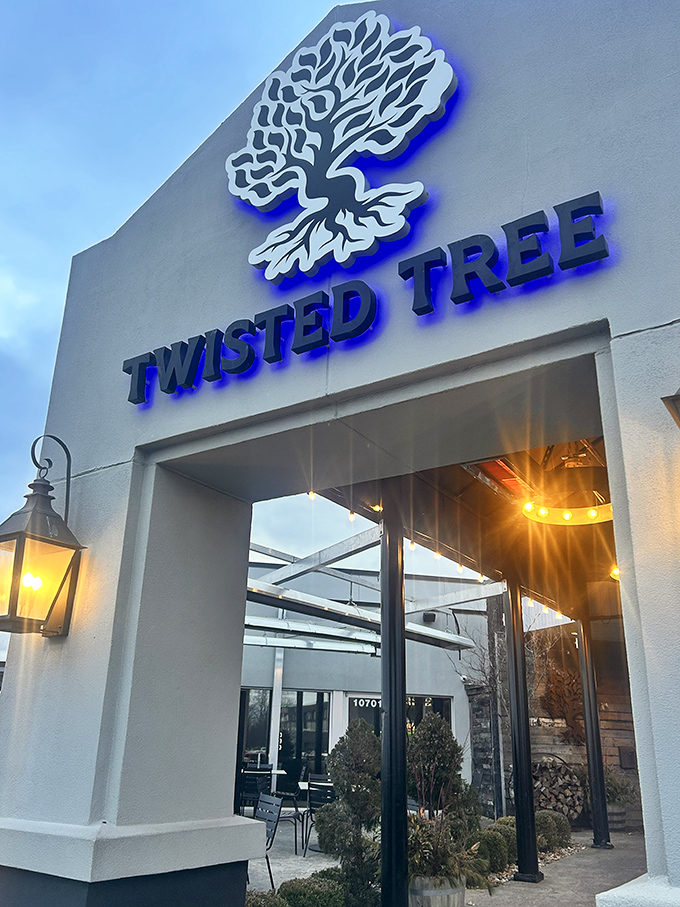 The welcoming facade of Twisted Tree Steakhouse stands proudly against the blue Missouri sky, lantern lights ready to guide hungry pilgrims to beef paradise.