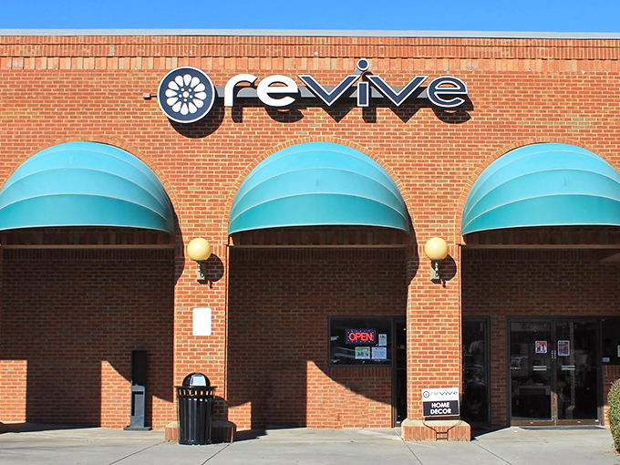 The brick fa&ccedil;ade and teal awnings of Revive Consignment stand like a beacon of bargain-hunting hope in Woodstock, inviting treasure-seekers to step inside and discover.
