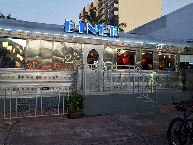 Chrome sweet chrome! This gleaming silver diner on Miami Beach's 11th Street promises nostalgic vibes and neon-lit indulgence at any hour.