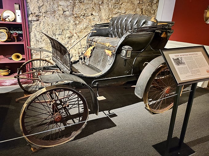 The 1899 Winton Phaeton looks more like a horseless carriage than a car, with its primitive controls and open design&mdash;the Model T's great-grandfather.