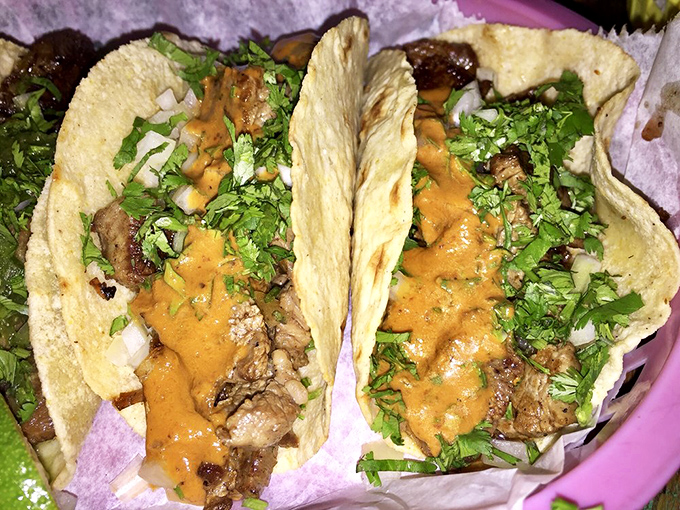 Steak tacos with the perfect char, topped with fresh cilantro and onion. Simple ingredients executed flawlessly&mdash;the hallmark of great cooking.