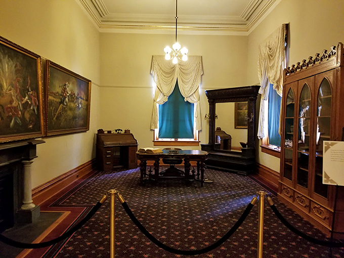 Victorian elegance preserved: period furniture, dramatic drapery, and historical paintings transport visitors to Louisiana's 19th-century political heyday.