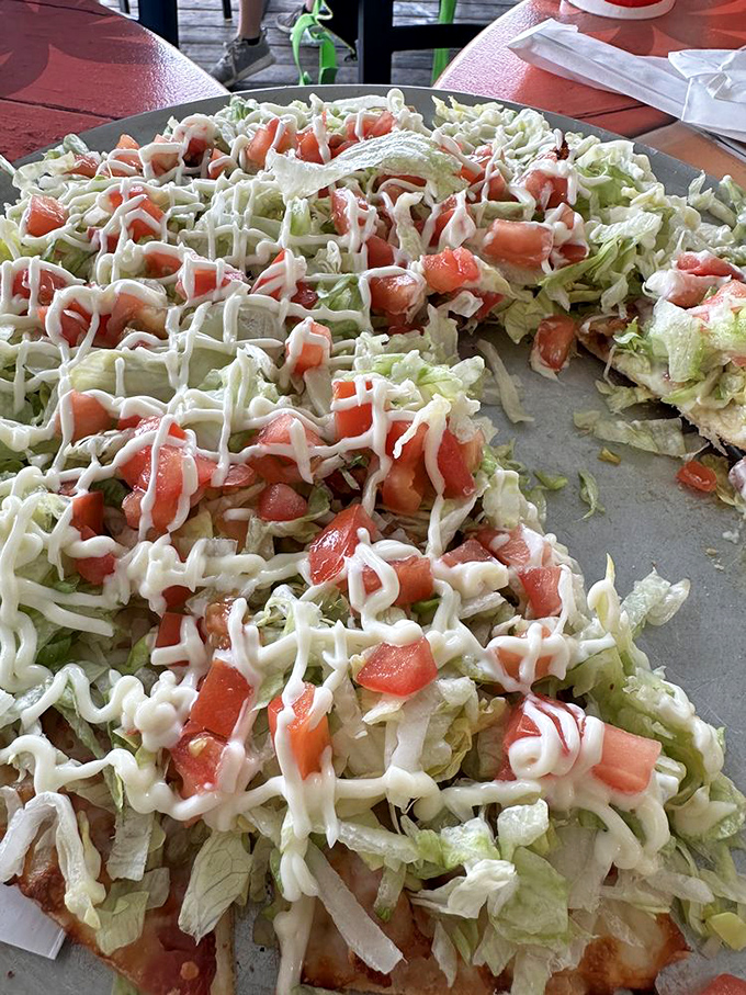 A BLT reimagined as a pizza is the kind of innovation that deserves a Nobel Prize. Fresh tomatoes and crisp lettuce create a garden on dough.